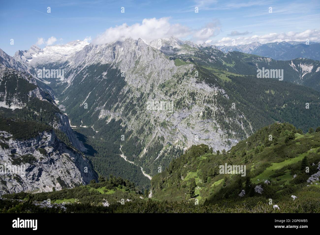 View into the Reintal valley, behind summit of the Zugspitze and ...