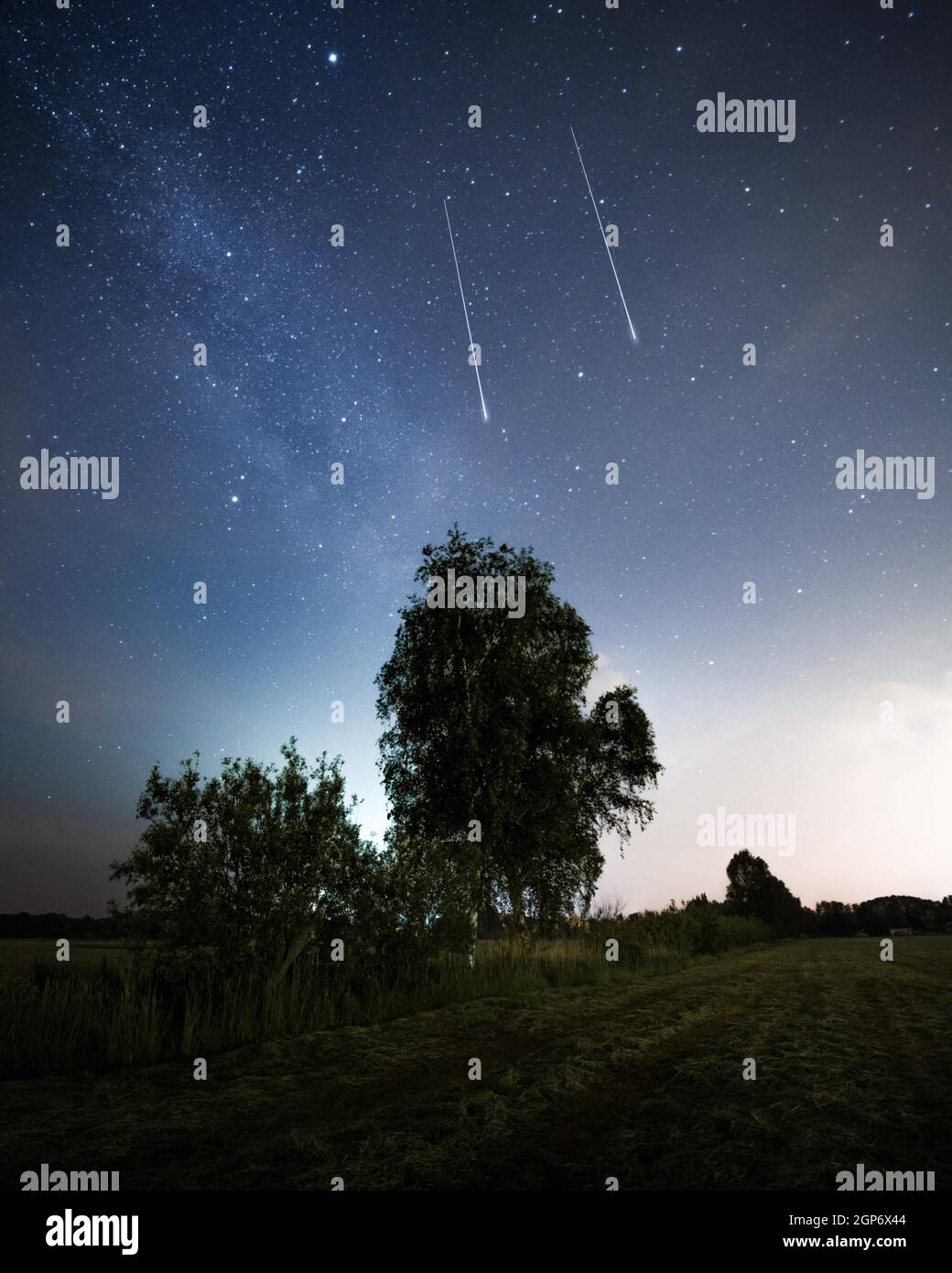 Two shooting stars with milky way in Brandenburg, Germany Stock Photo ...