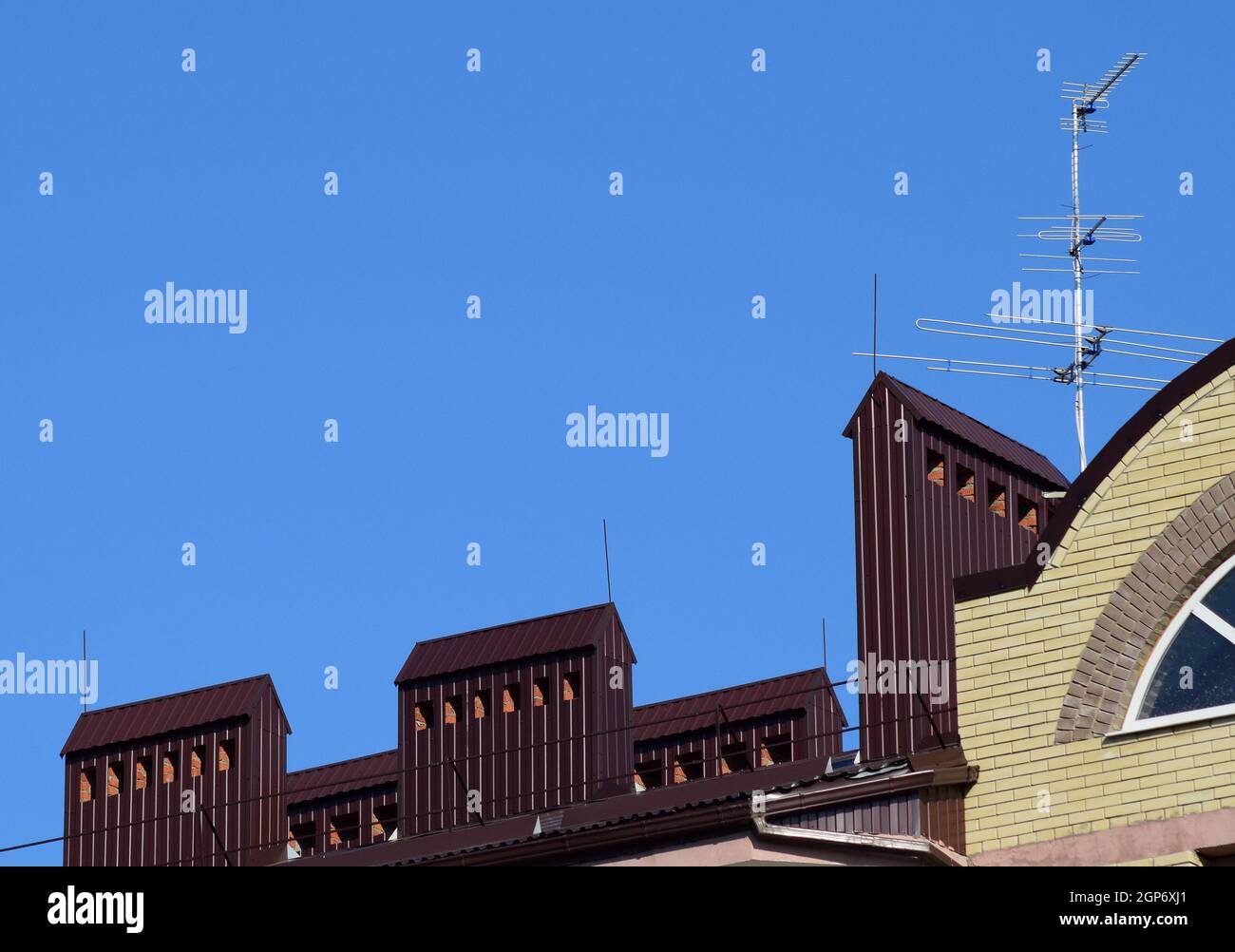 The roof of a multistory building. The roof of the metal sheets ...