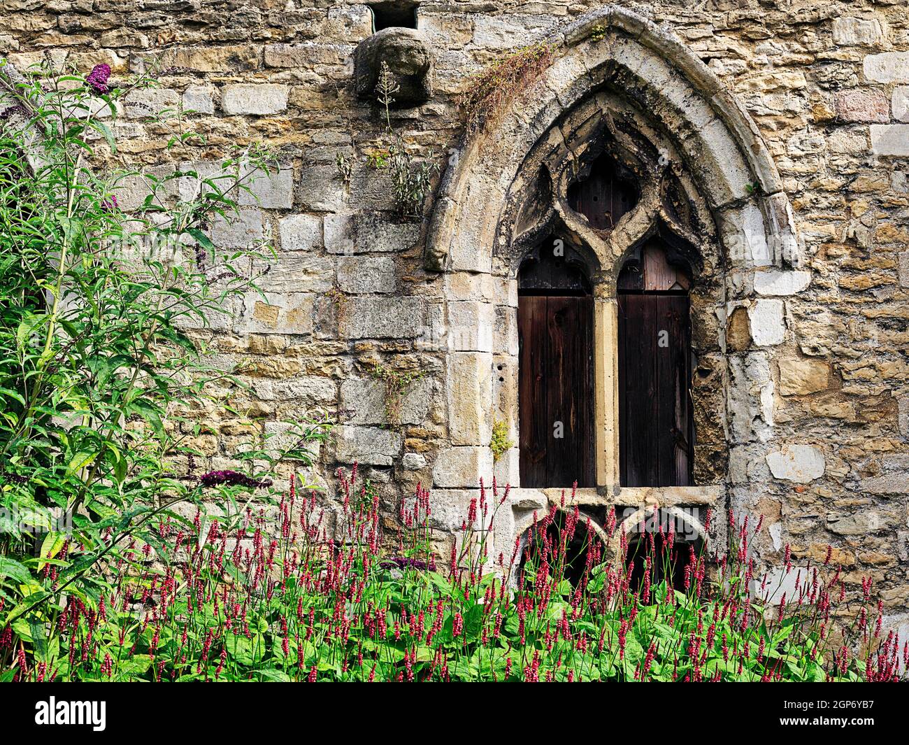 Round-arched window facade, remains of medieval monastery, Peterborough ...