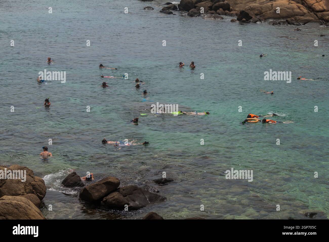 PIGEON ISLAND, SRI LANKA - JULY 25, 2016: People snorkel on a coral ...