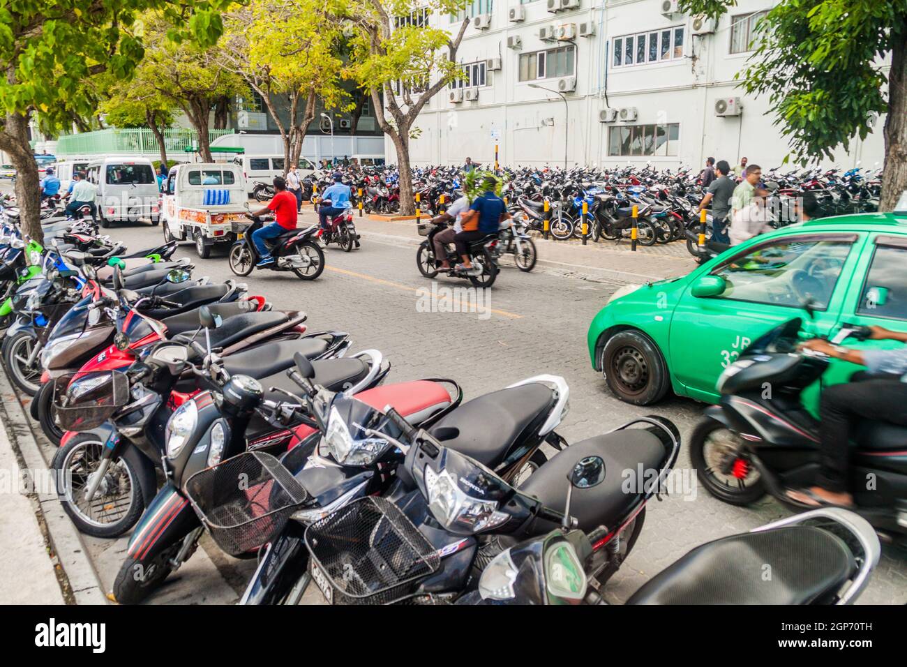 MALE, MALDIVES - JULY 11, 2016: Traffic on Boduthakurufaanu Magu street ...