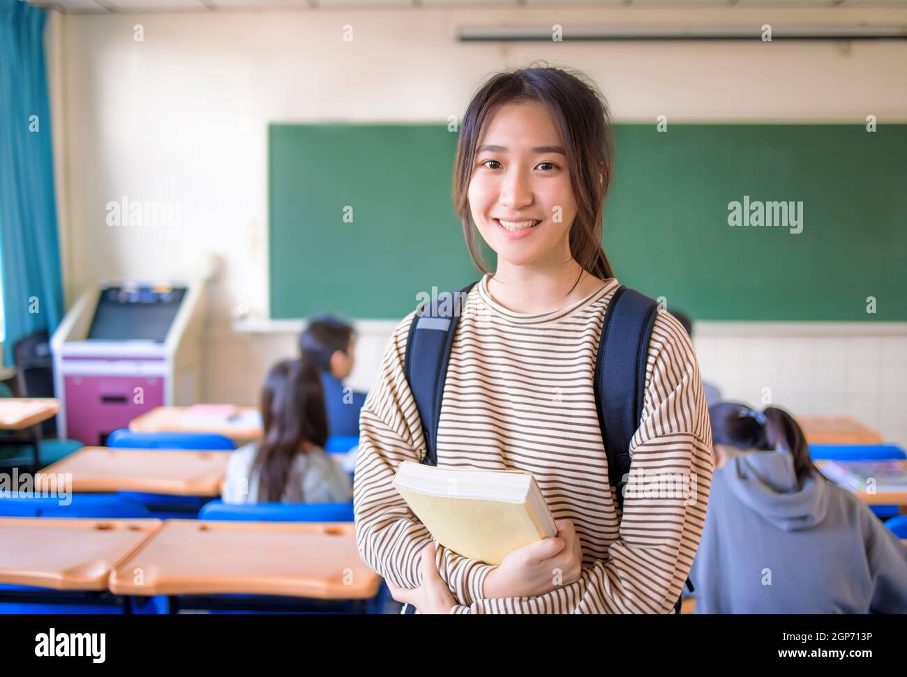 Portrait of asian cute student teenager girl in classroom Stock Photo ...