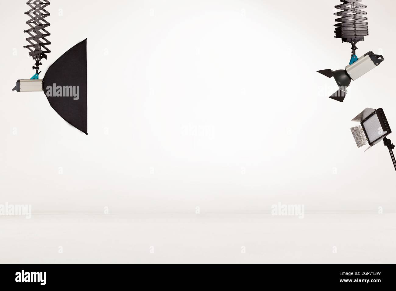 Empty white room with studio lights. Seamless white photography ...