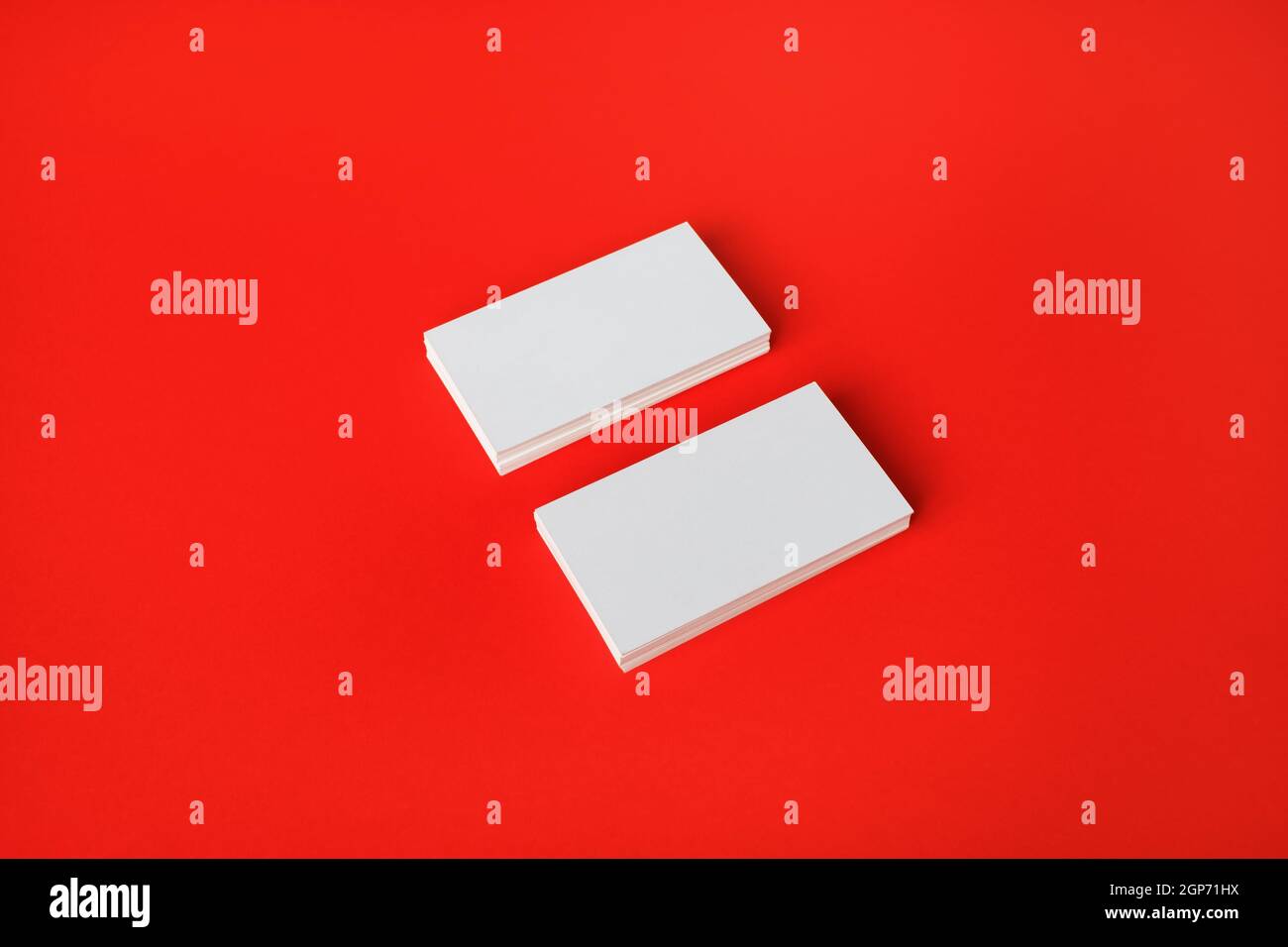 Photo of blank white business cards on red paper background. Template ...