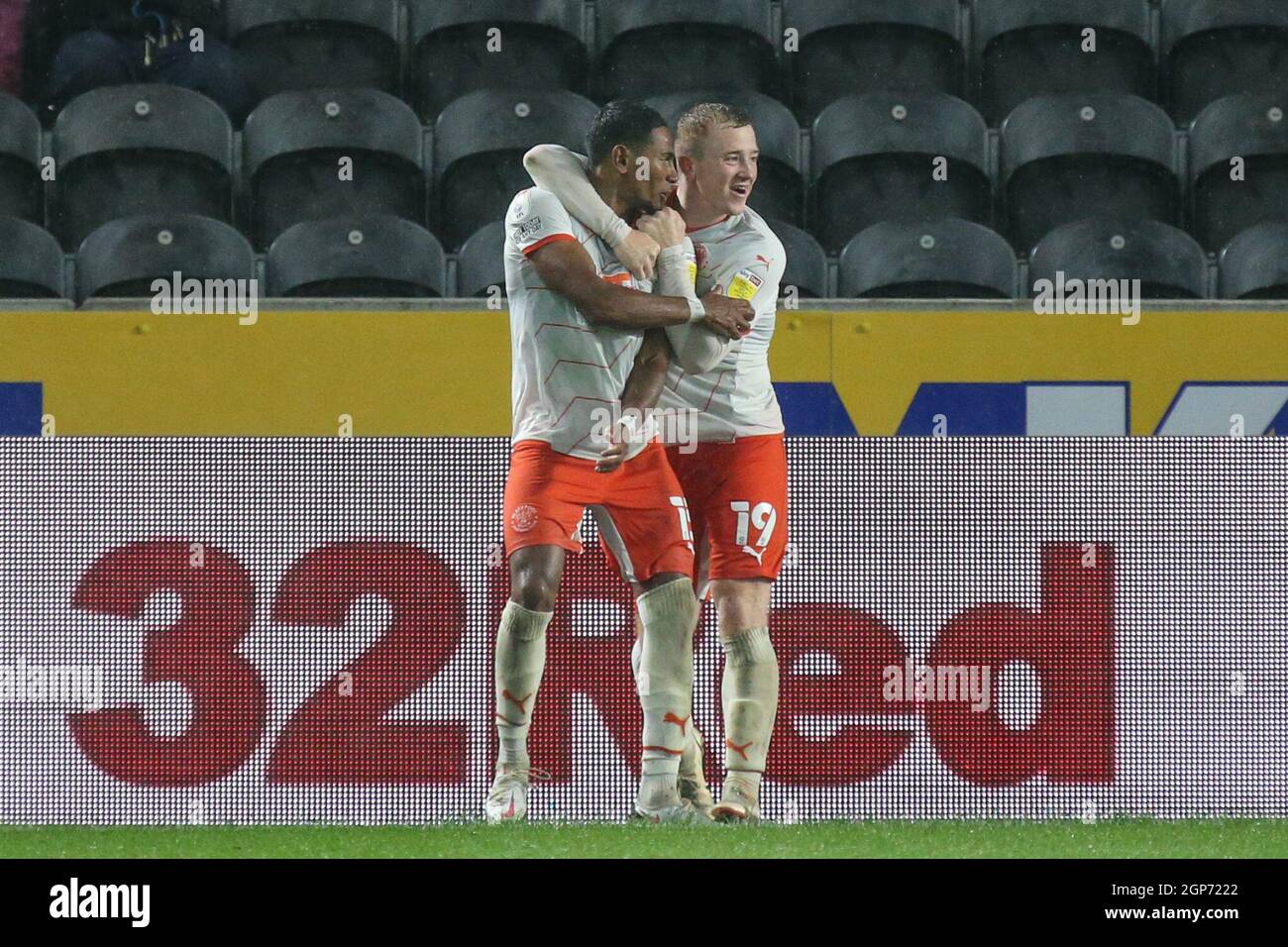 Shayne Lavery #19 of Blackpool celebrates his goal with Demi Mitchell ...