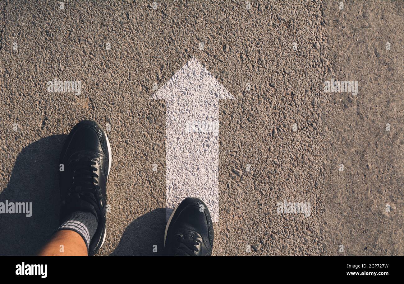 A person standing at the crossroad and get to decision which way to go ...