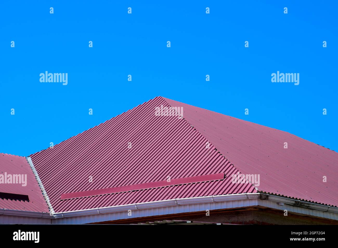 The roof of corrugated sheet. Roofing of metal profile wavy shape Stock ...