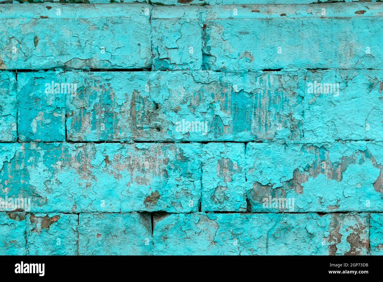 peeled off old turquoise paint on flat rough brick wall surface - full ...