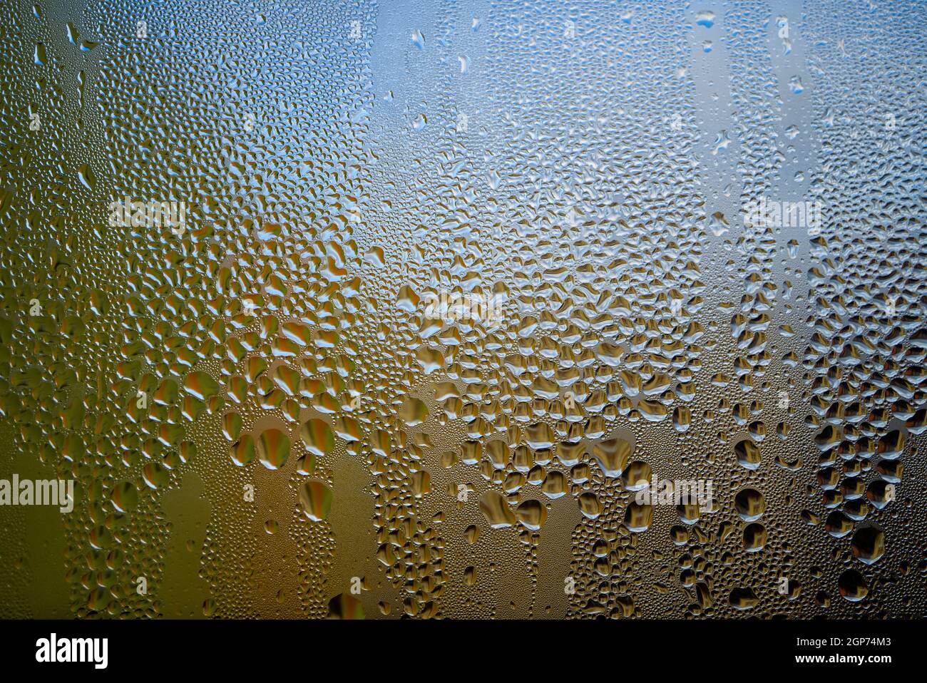 Condensation with beaded moisture droplets on the outside of a cold ...