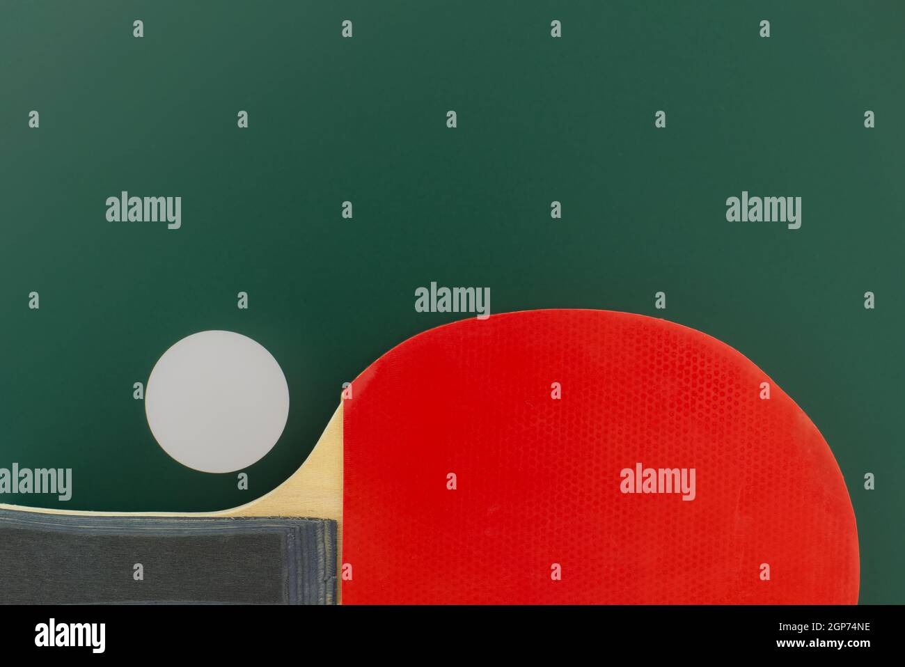 Table tennis equipment, racks and balls on green background with free ...