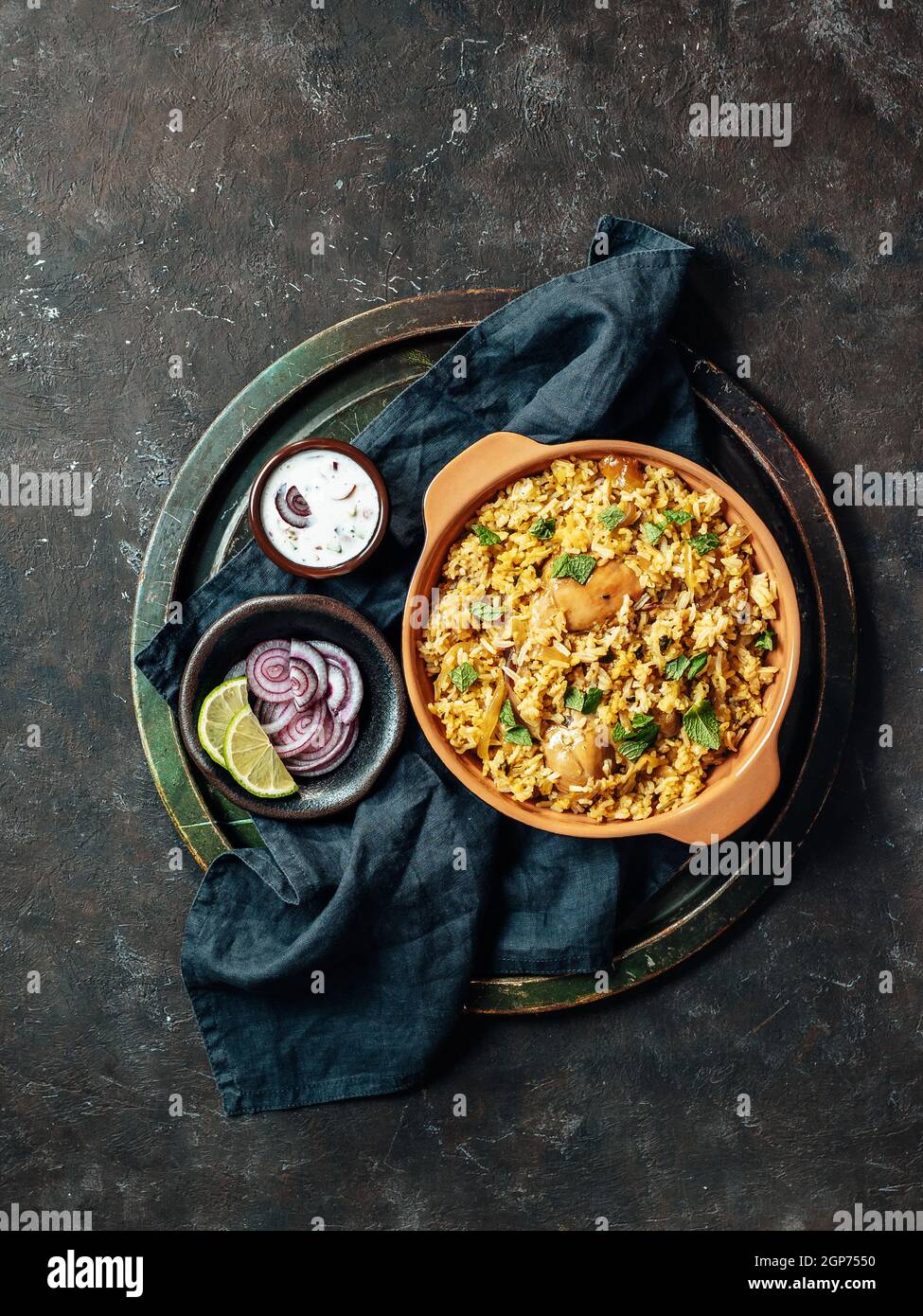 Pakistani food - biryani rice with chicken and raita yoghurt dip ...