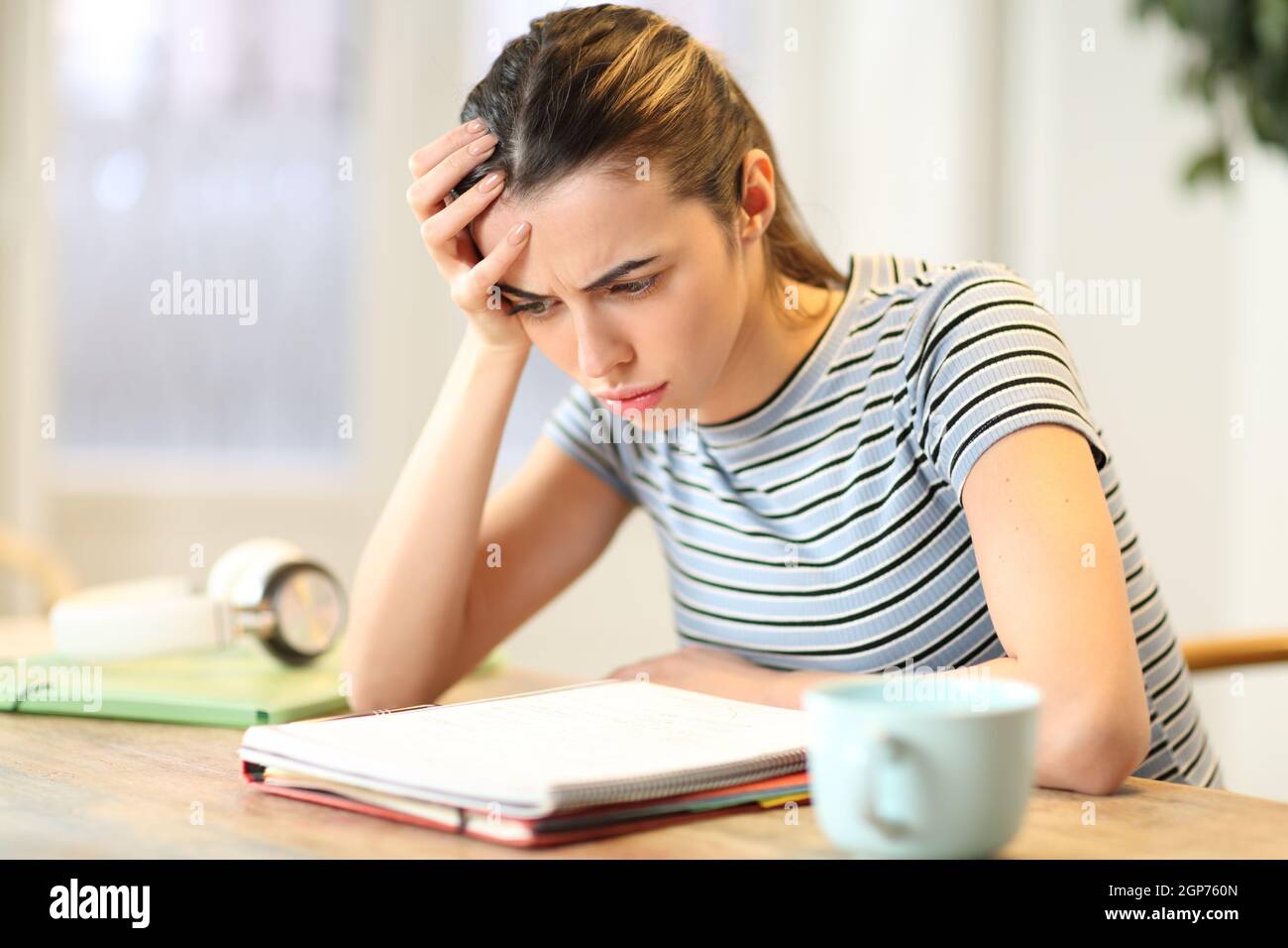 Frustrated teenage girl studying desk hi-res stock photography and ...