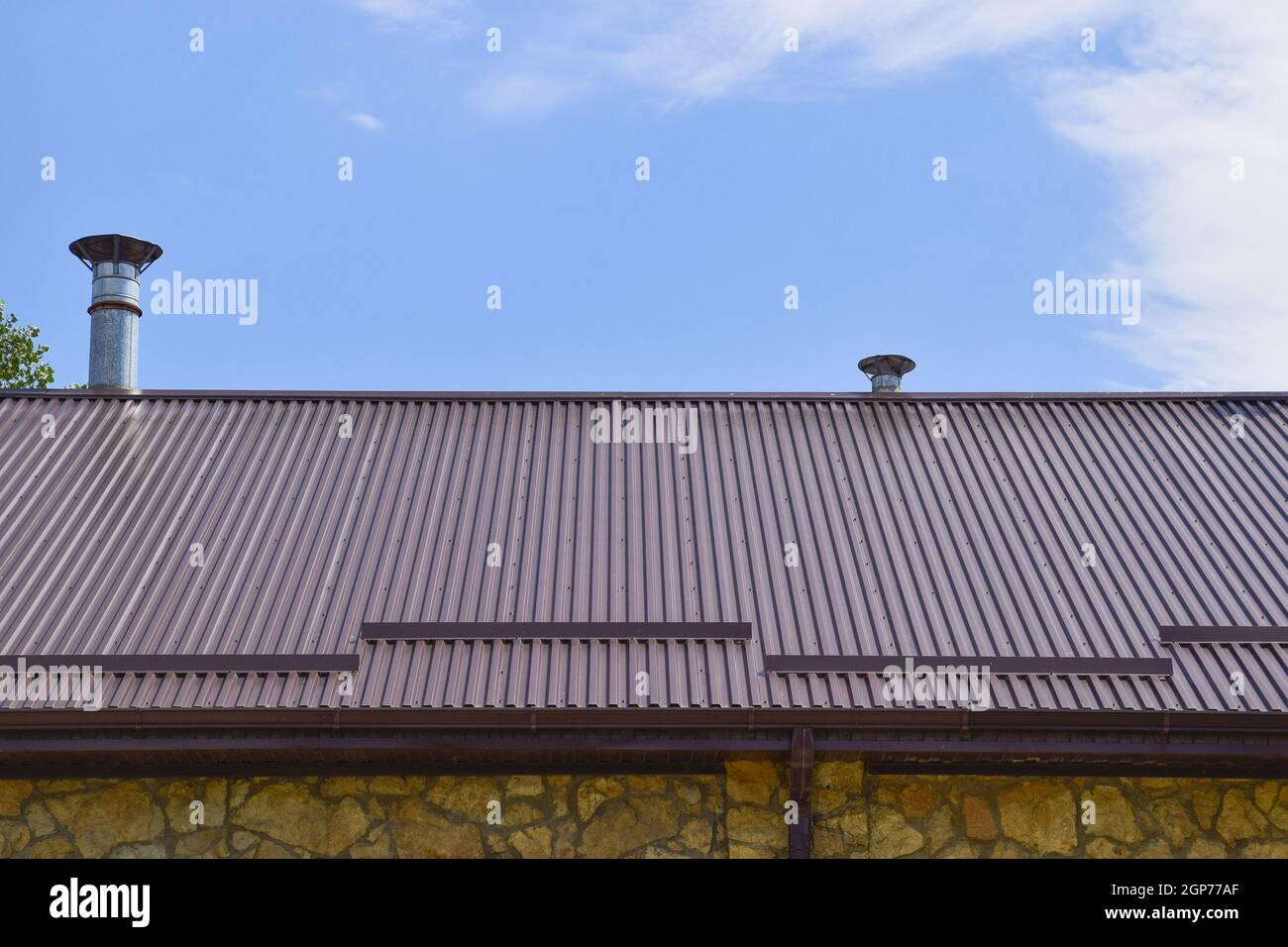 The roof of corrugated sheet. Roofing of metal profile wavy shape Stock ...