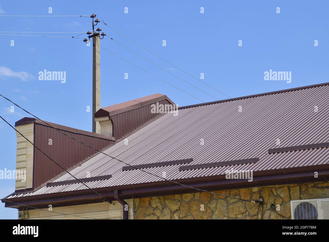 The roof of corrugated sheet. Roofing of metal profile wavy shape Stock ...
