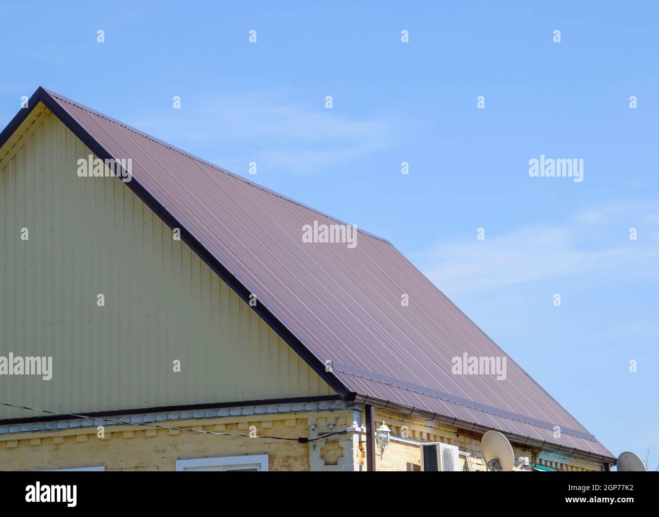 The roof of corrugated sheet. Roofing of metal profile wavy shape Stock ...