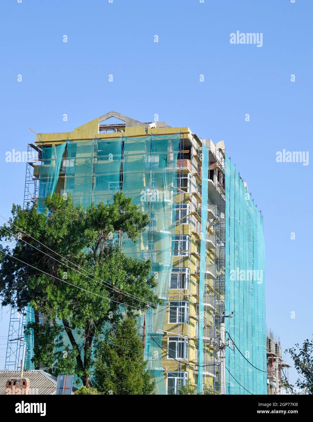 Safety net in the newly built high-rise building. Green grid on ...