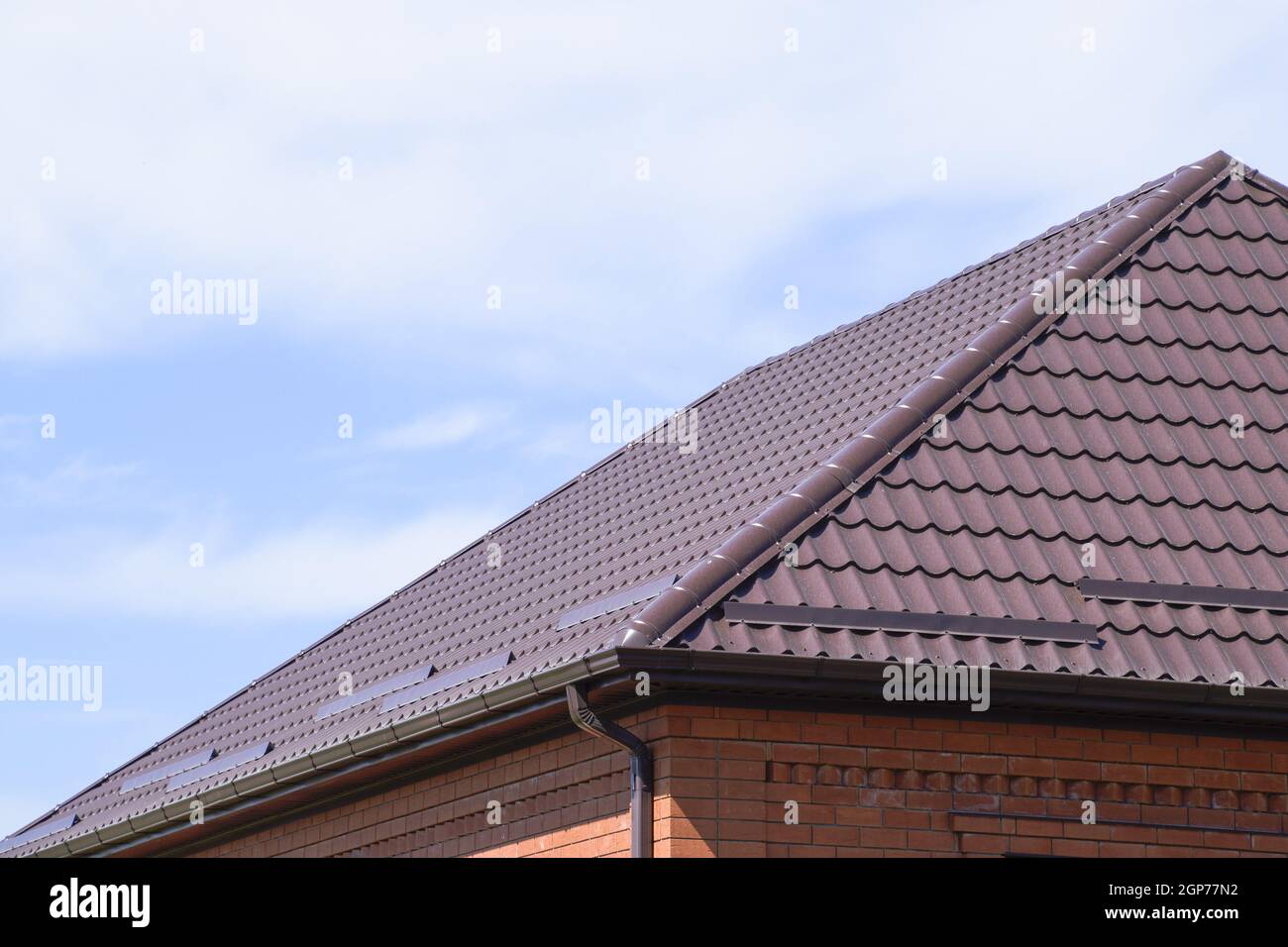 The roof of corrugated sheet. Roofing of metal profile wavy shape Stock ...