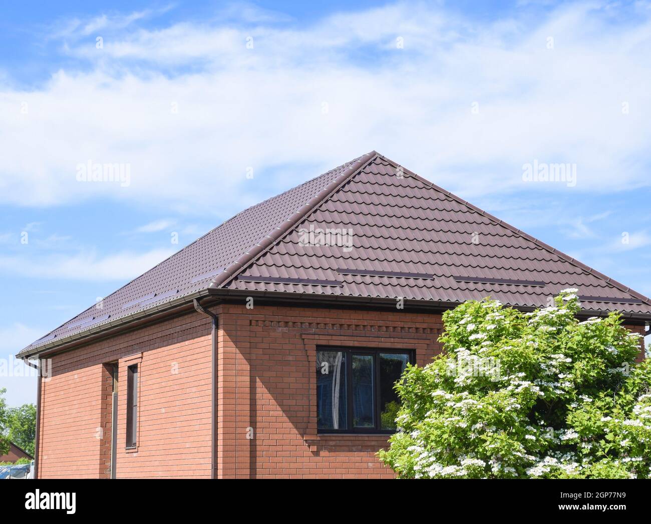 The roof of corrugated sheet. Roofing of metal profile wavy shape Stock ...
