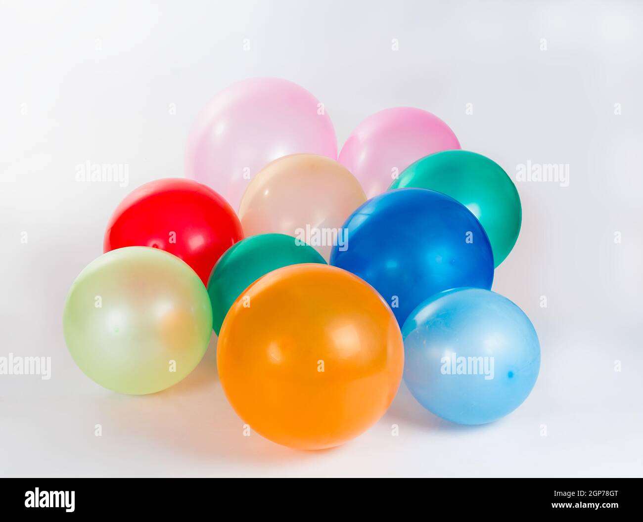 Colorful balloons of different colors on white background Stock Photo ...