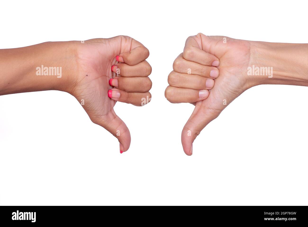 Female hands making signals with the thumb down Stock Photo - Alamy