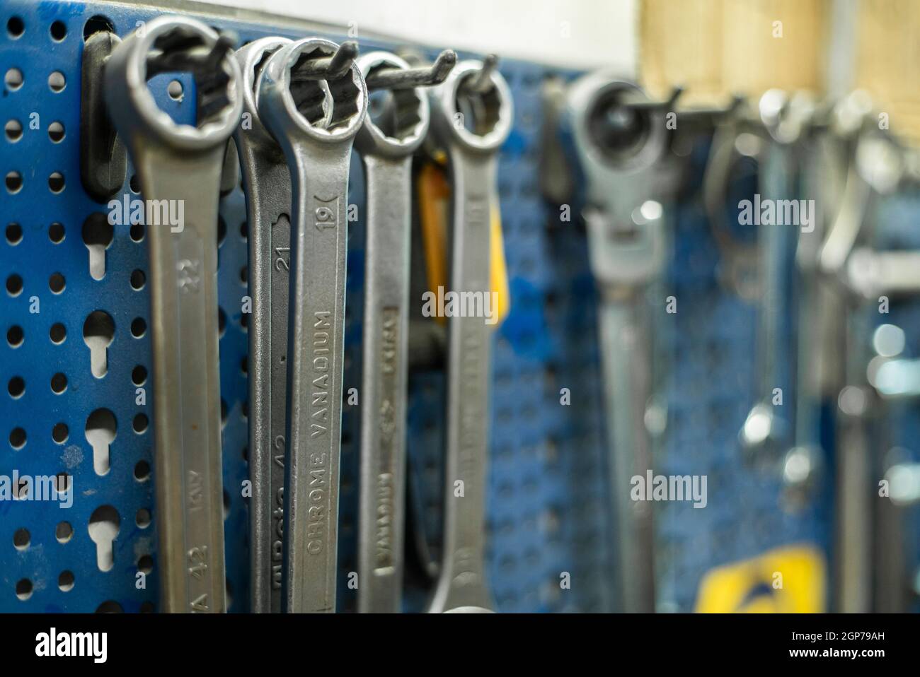 Wrenches hanging on the shelf in the mechanical workshop Stock Photo ...