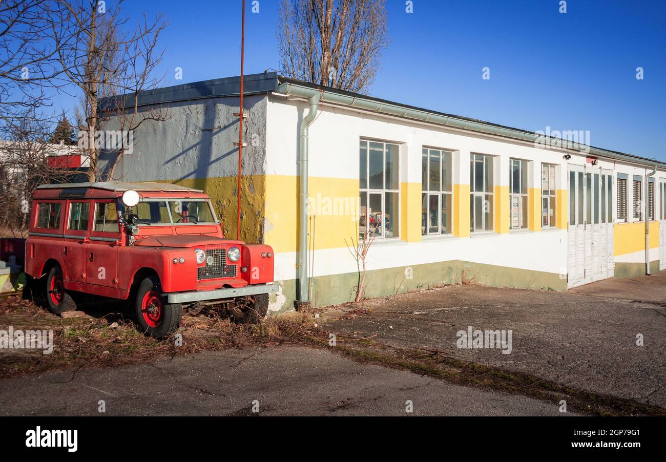 old red off-road car on a parking spot Stock Photo - Alamy