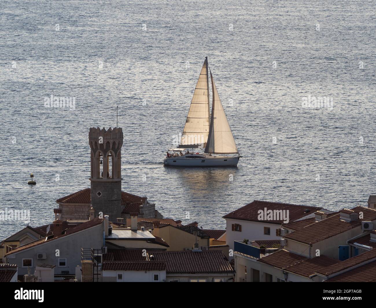 View of a sailing ship from the tower of St. George's Cathedral, Piran ...