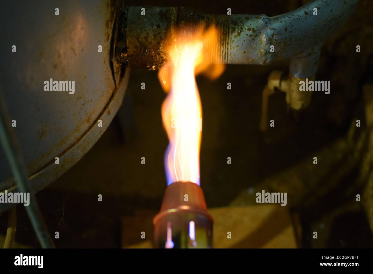 Heating a steel pipe with a blowtorch. The flame of a blowtorch Stock ...