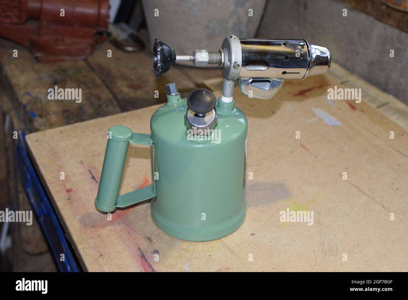 Blowtorch, general view. Blowtorch with a green tank Stock Photo - Alamy