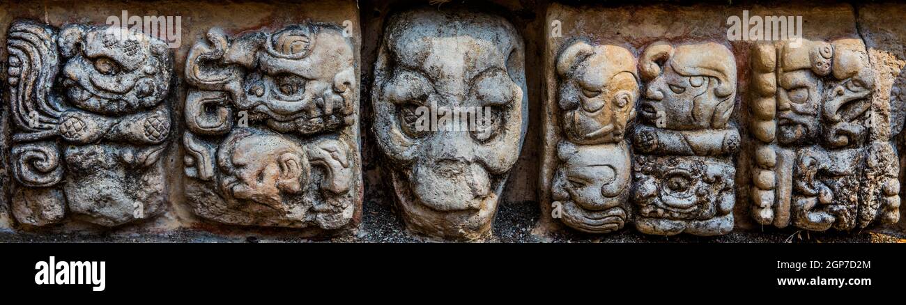 Glyphs and masks at the Temple of Meditation, East Plaza with Structure ...