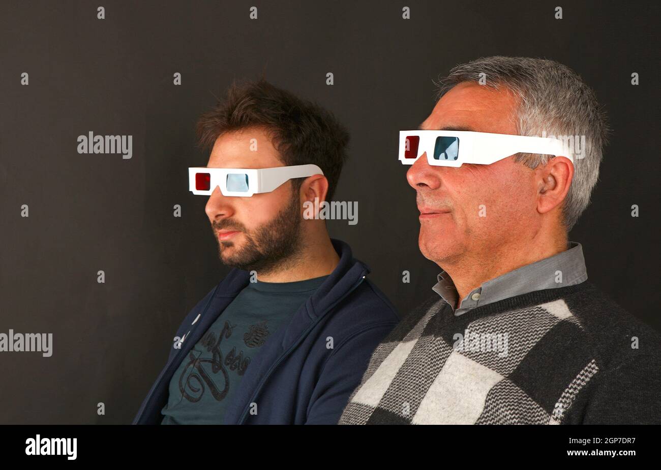 Two Men Wearing 3d Glasses on black background Stock Photo - Alamy