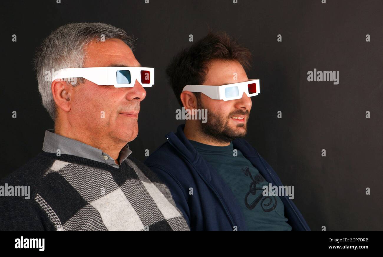 Two Men Wearing 3d Glasses on black background Stock Photo - Alamy