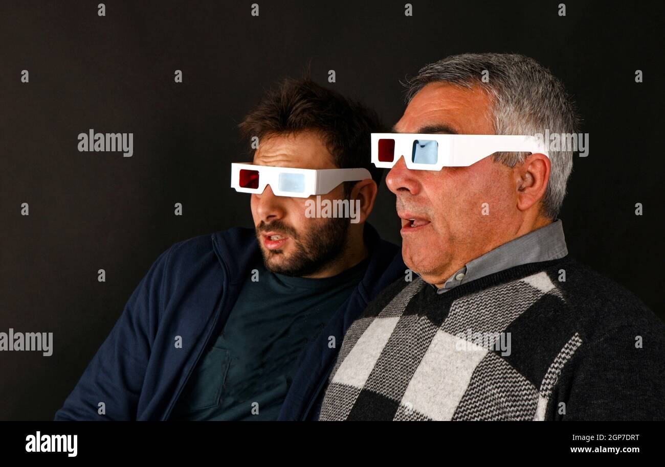 Two Men Wearing 3d Glasses on black background Stock Photo - Alamy