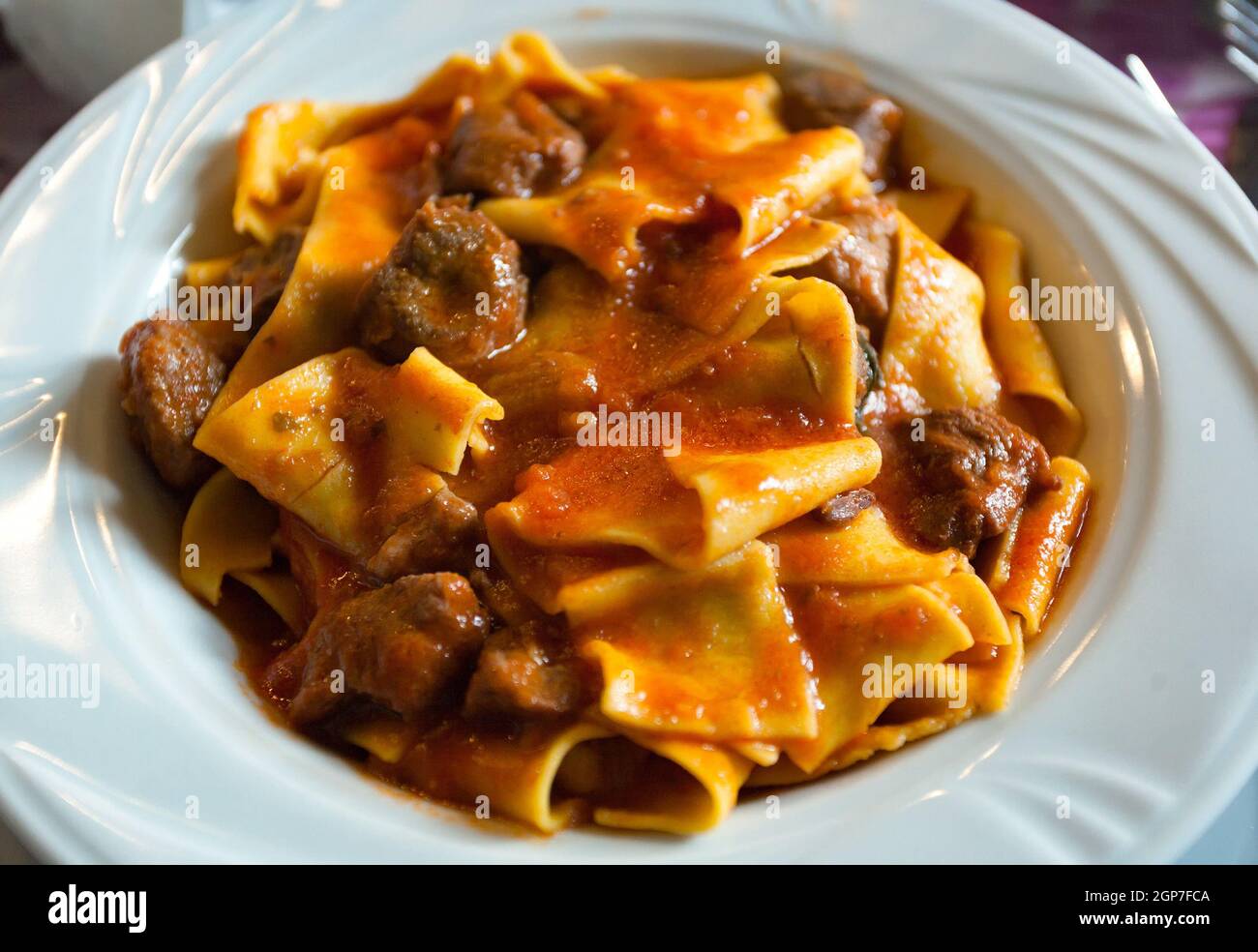 Pappardelle with boar ragu. Tuscan typical recipe of italian pasta ...