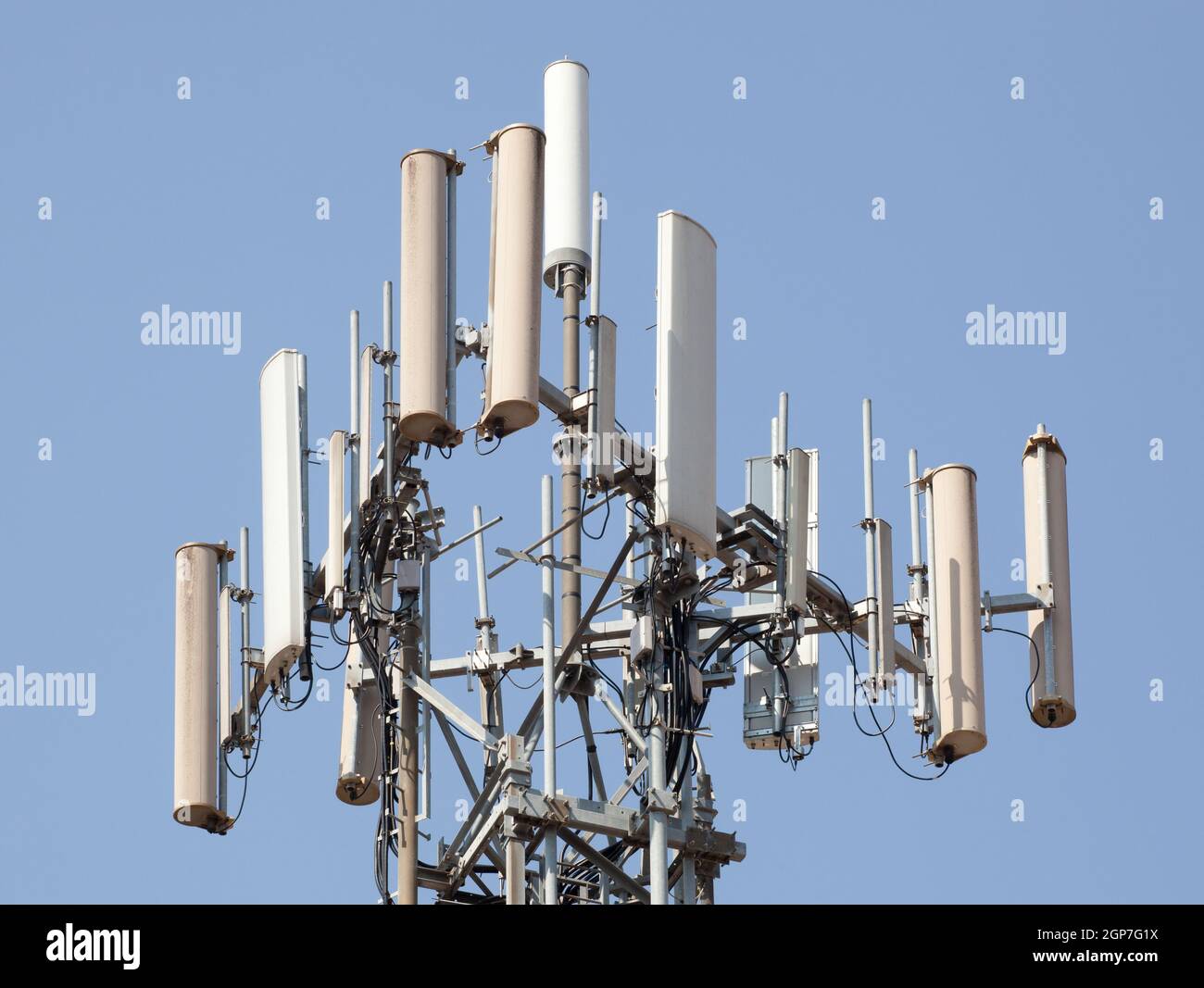 Close up of antenna repeater tower on blue sky Stock Photo - Alamy