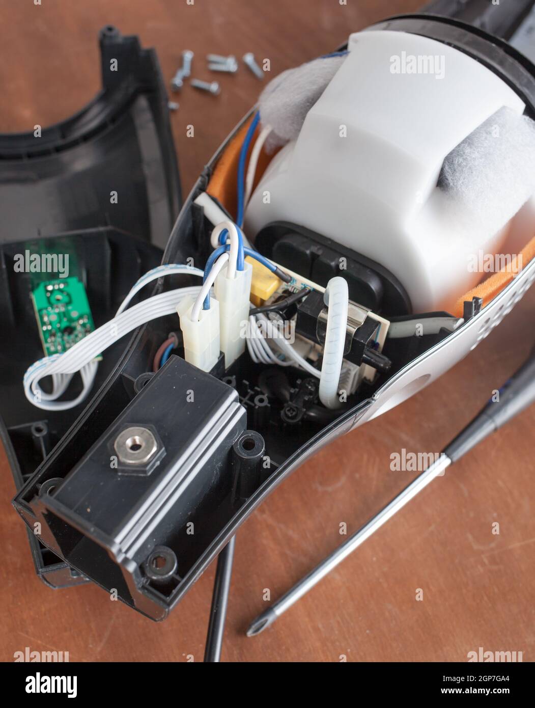 Vacuum cleaner disassembled for repair malfunctioning on work table ...