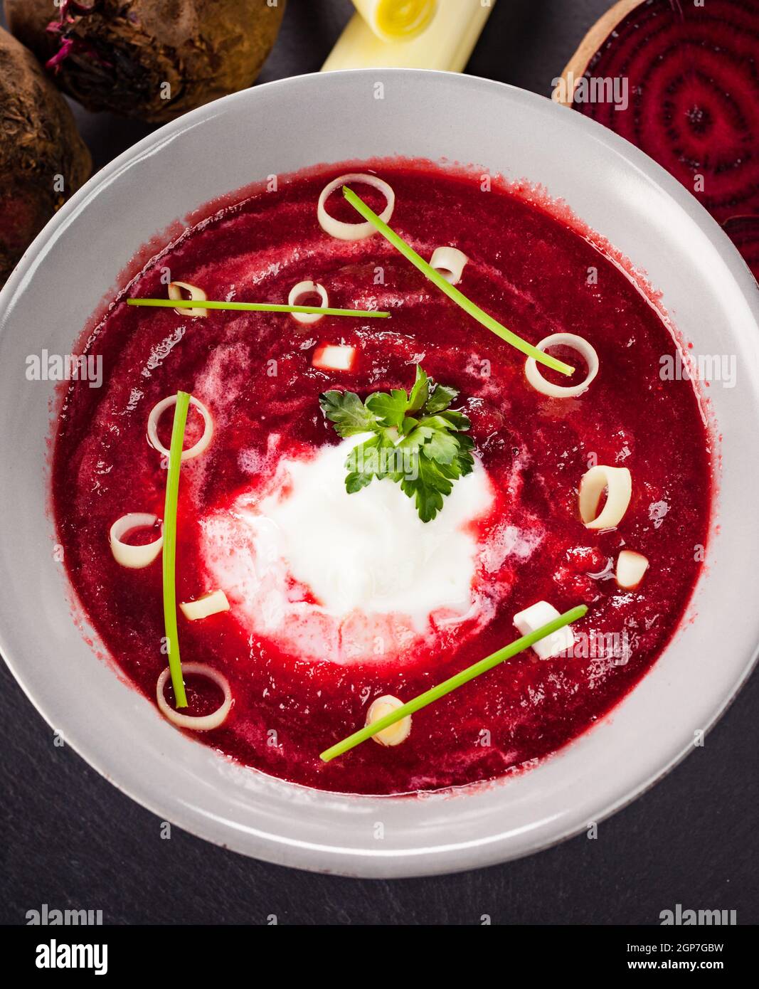 Beetroot, red borscht with sour cream, leek, chives and parsley Stock ...