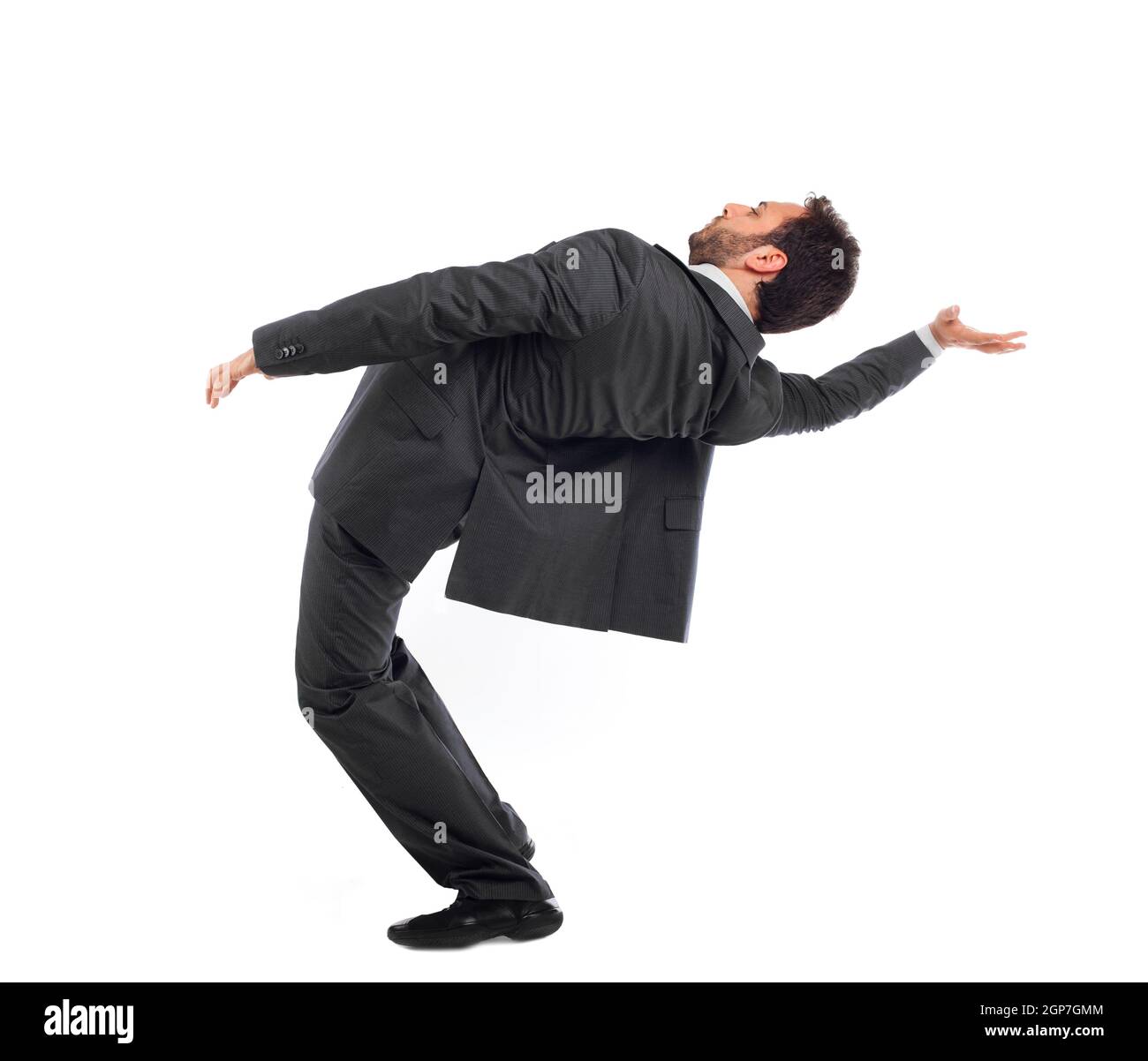 Young businessman simulates the position of Neo in the Matrix movie ...