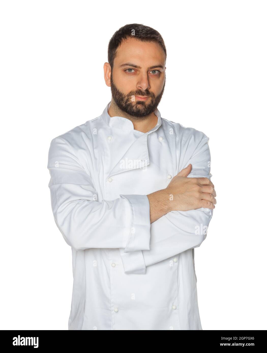 Young chef in white uniform without hat isolated on white background ...