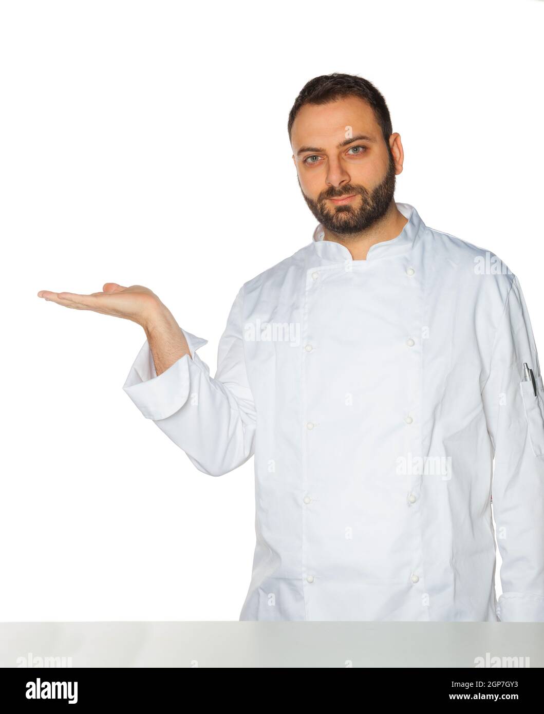 Young chef in white uniform without hat isolated on white background ...