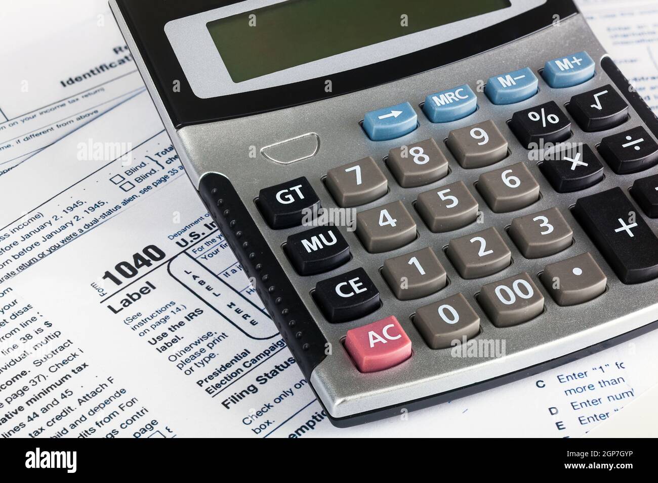 US Individual Tax Return Form 1040 close up with calculator Stock Photo ...