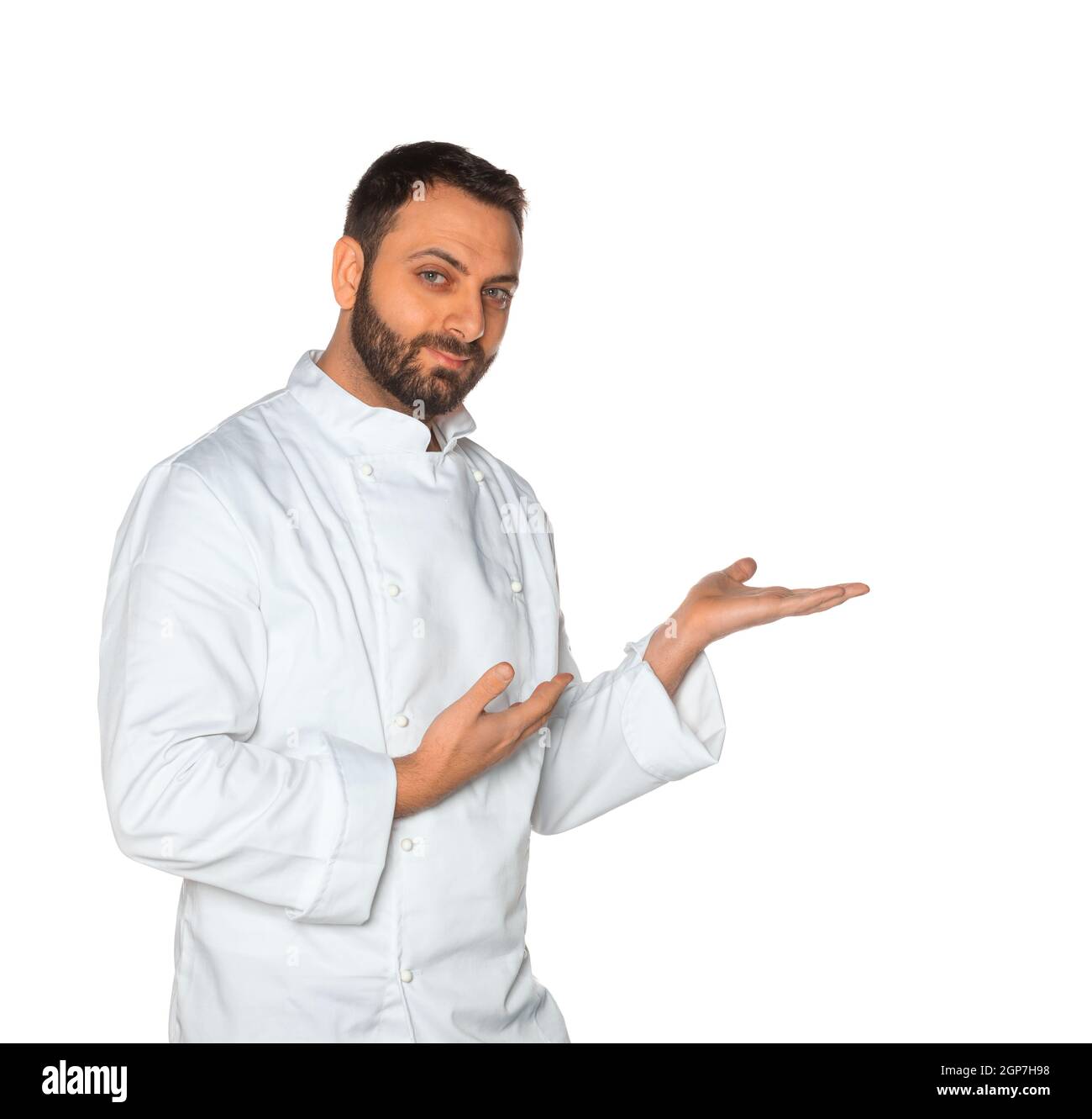 Young chef in white uniform without hat isolated on white background ...