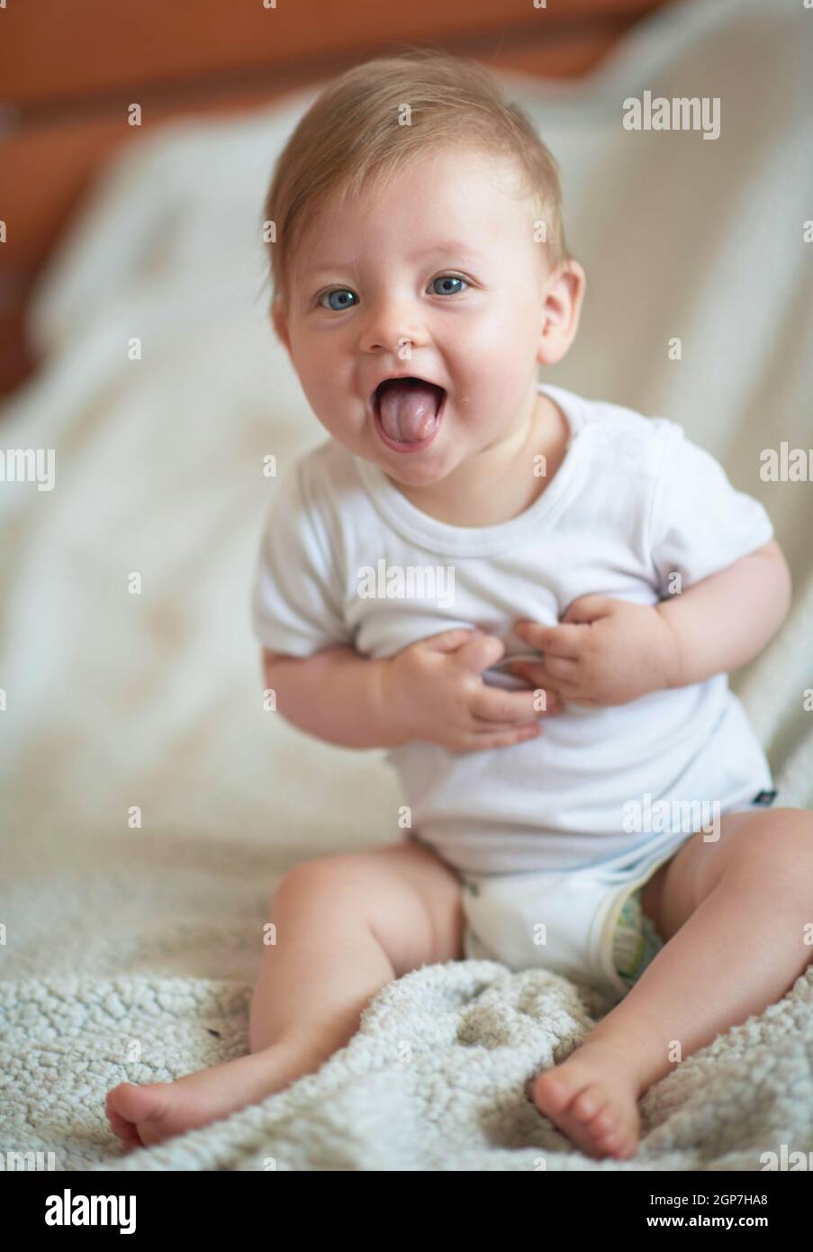 cute little newborn baby smilling at home Stock Photo - Alamy