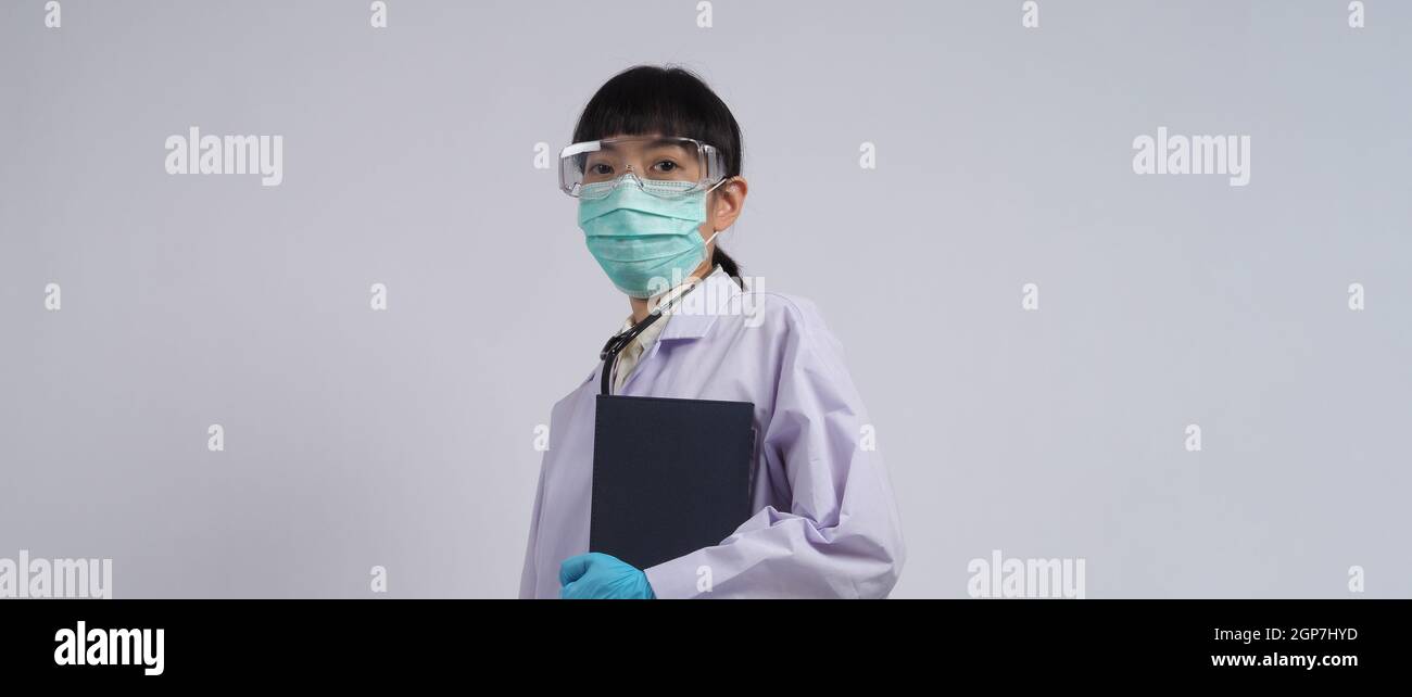 Doctor in uniform points to an empty area. Wearing blue medical latex ...