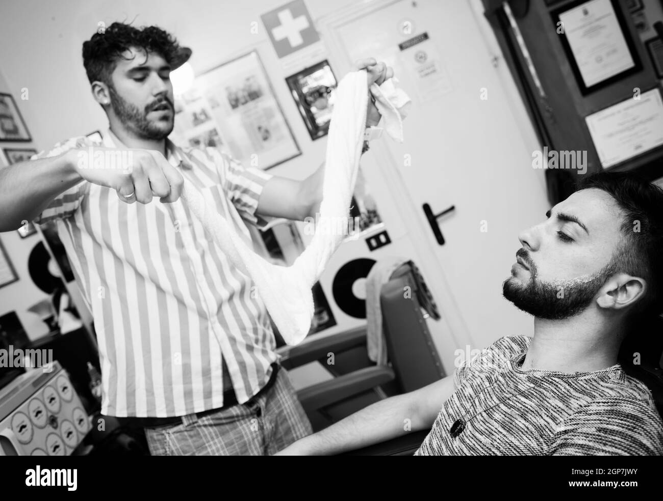 Traditional ritual of shaving the beard in a old style barber shop ...