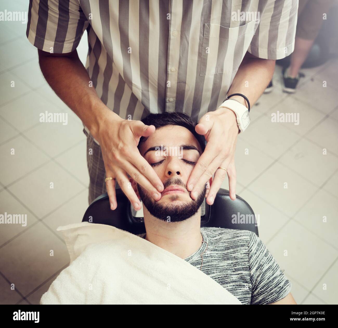 Traditional ritual of shaving the beard in a old style barber shop ...