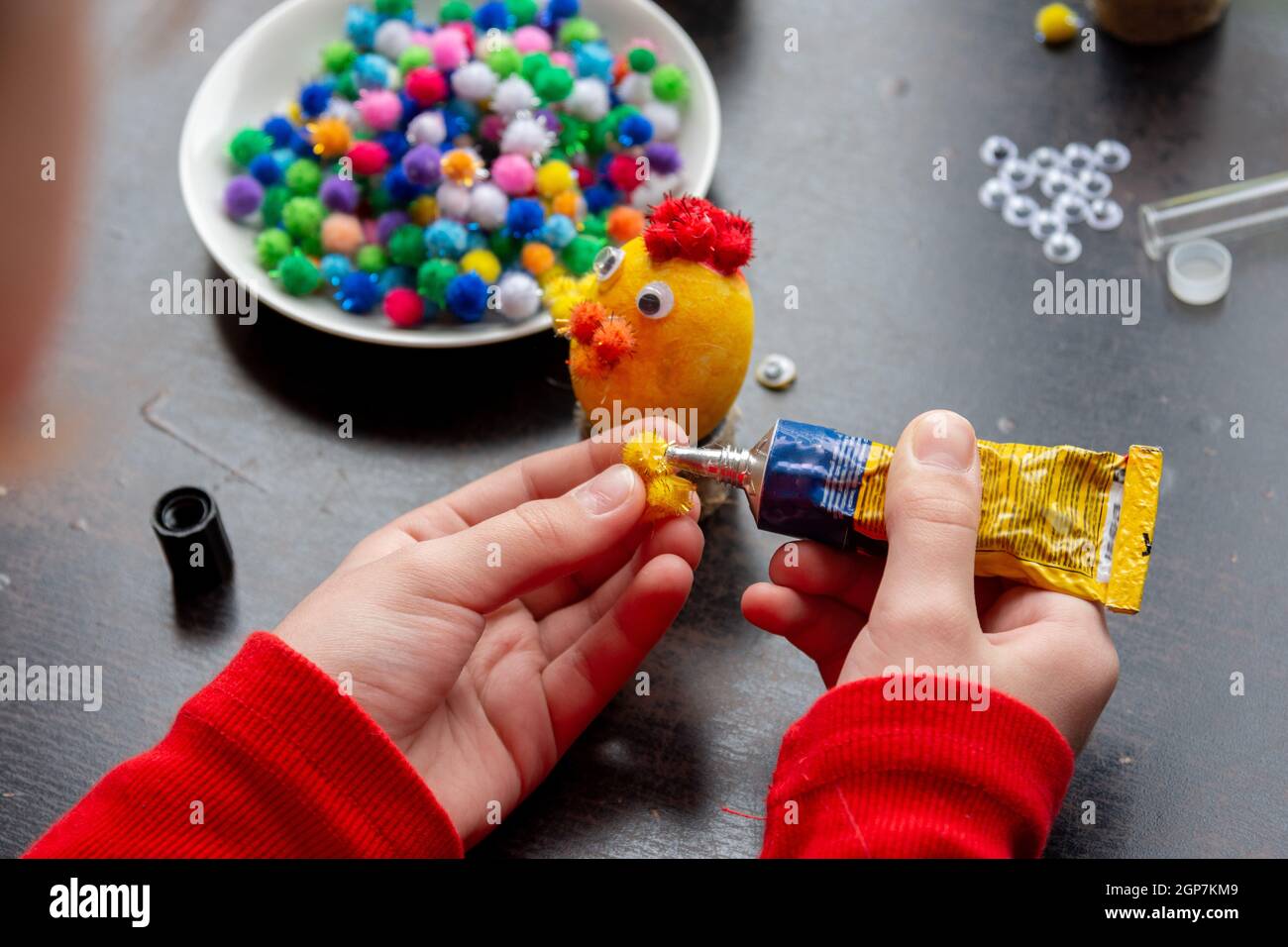 Child's hands make a chicken-shaped egg shell craft Stock Photo - Alamy