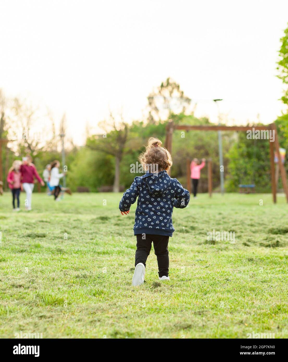 Little girl running behind little hi-res stock photography and images ...