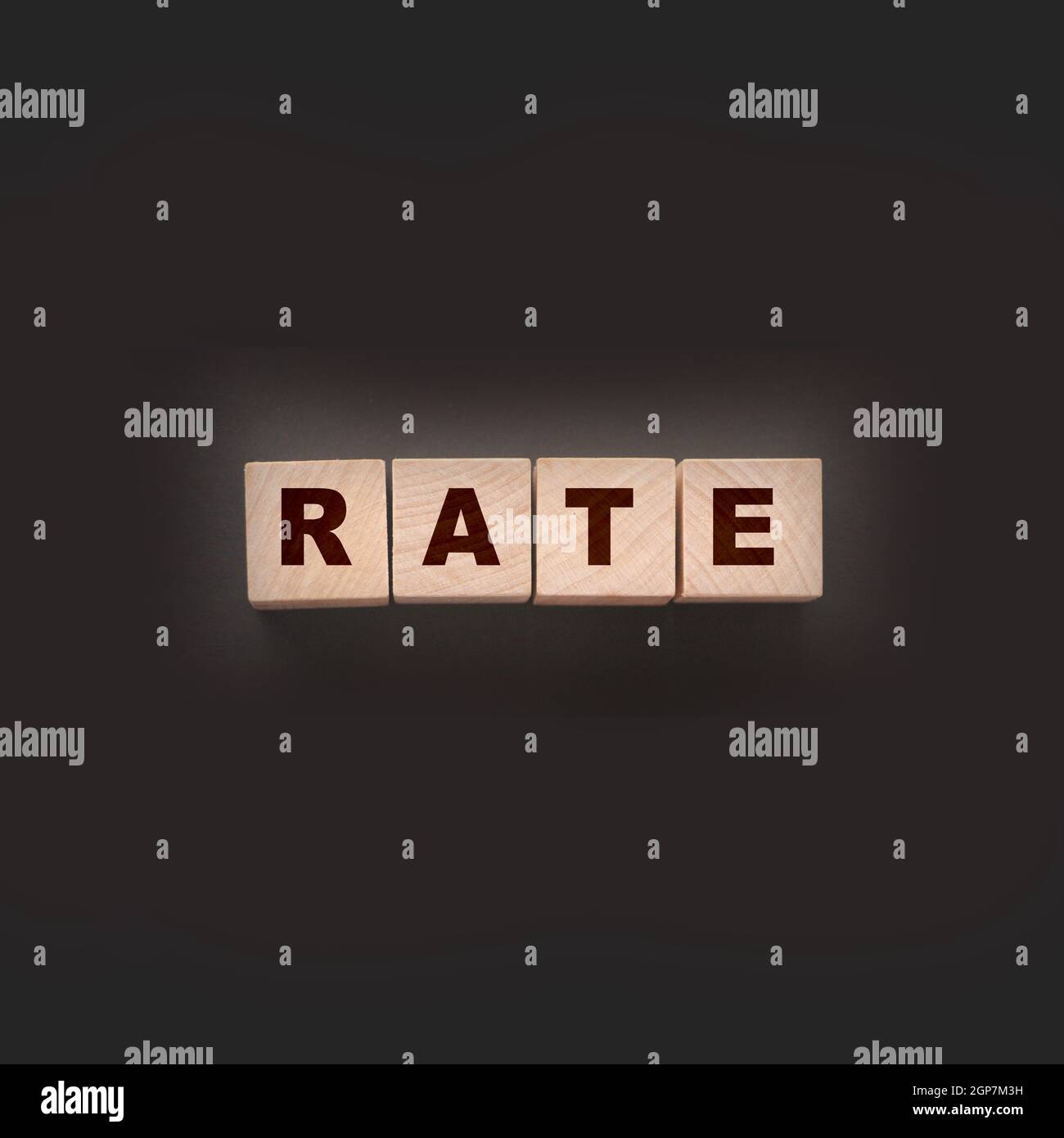 Rate word concept written on wooden cubes blocks lying on a black ...